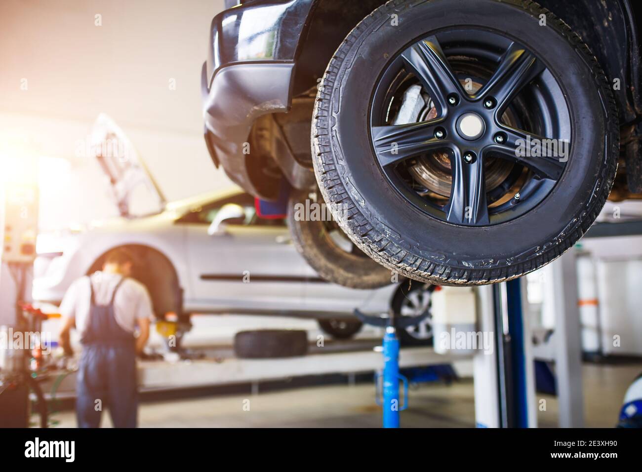 Car lifted up in service station hi-res stock photography and images ...