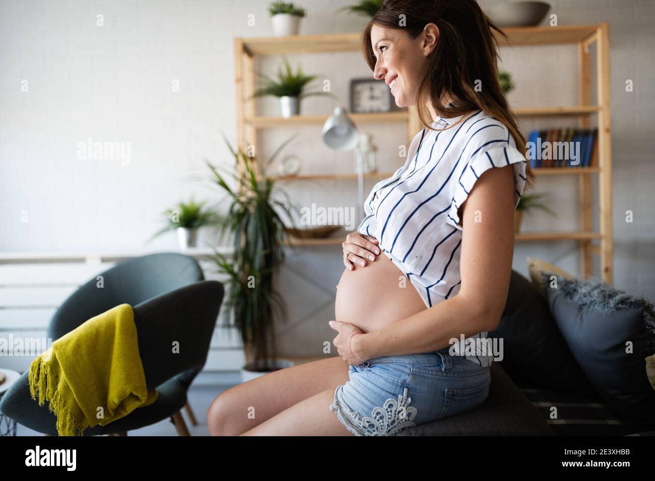 Beautiful pregnant woman expecting baby. Maternity concept Stock Photo ...