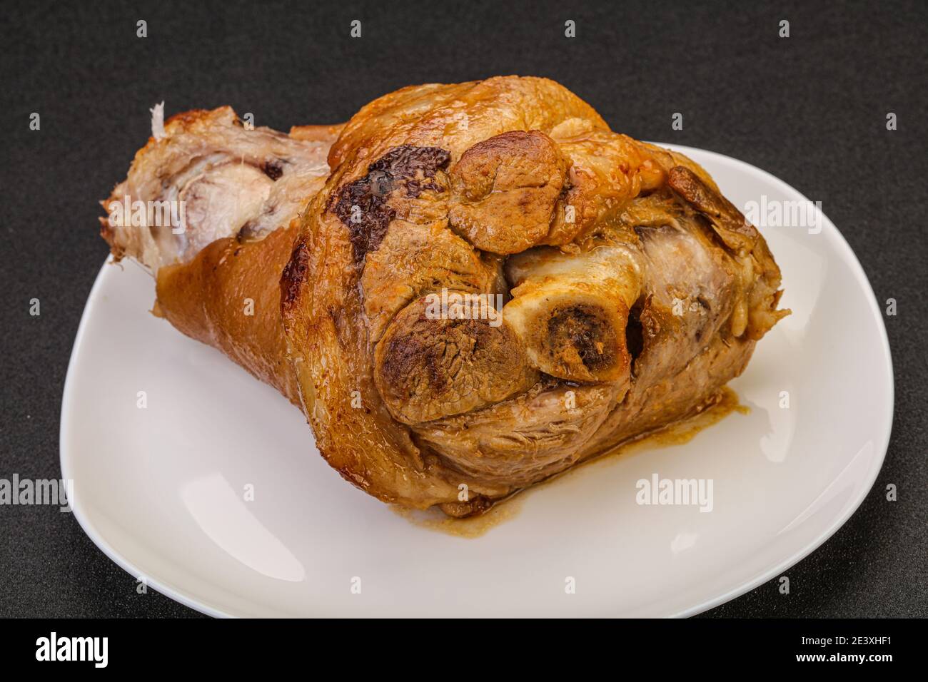 Baked pork knuckle with spices and herbs Stock Photo - Alamy