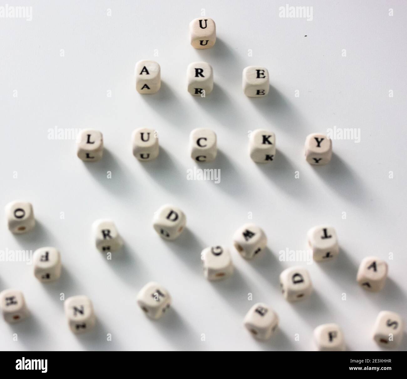 You are lucky words written on wood blocks, white table, black and ...