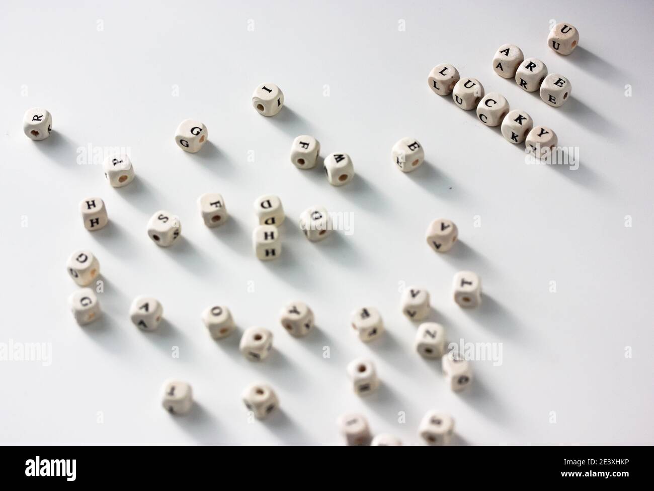 You are lucky words written on wood blocks, white table, black and ...