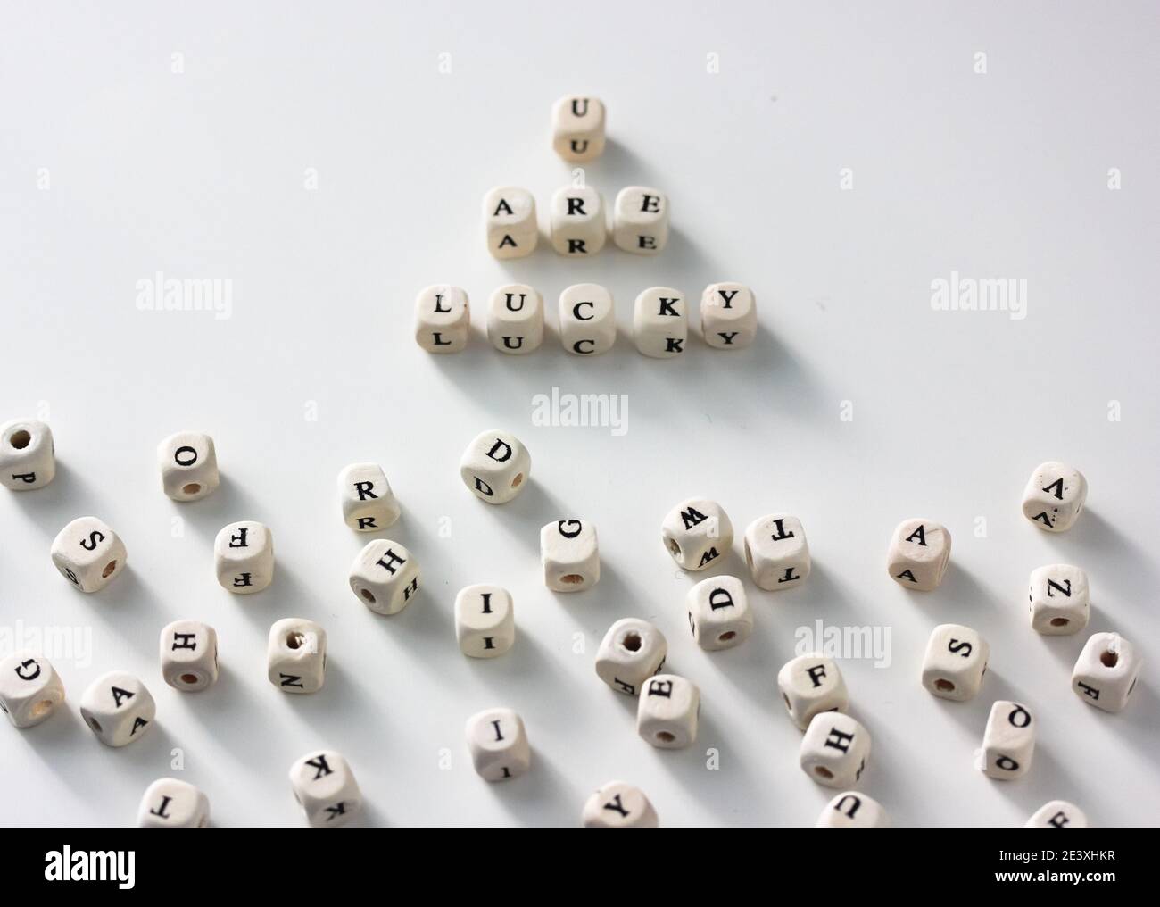 You are lucky words written on wood blocks, white table, black and ...