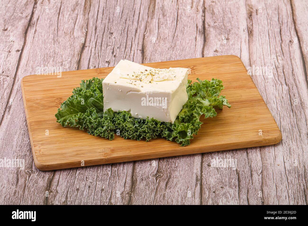Traditional tasty Greek Feta soft cheese brick Stock Photo - Alamy