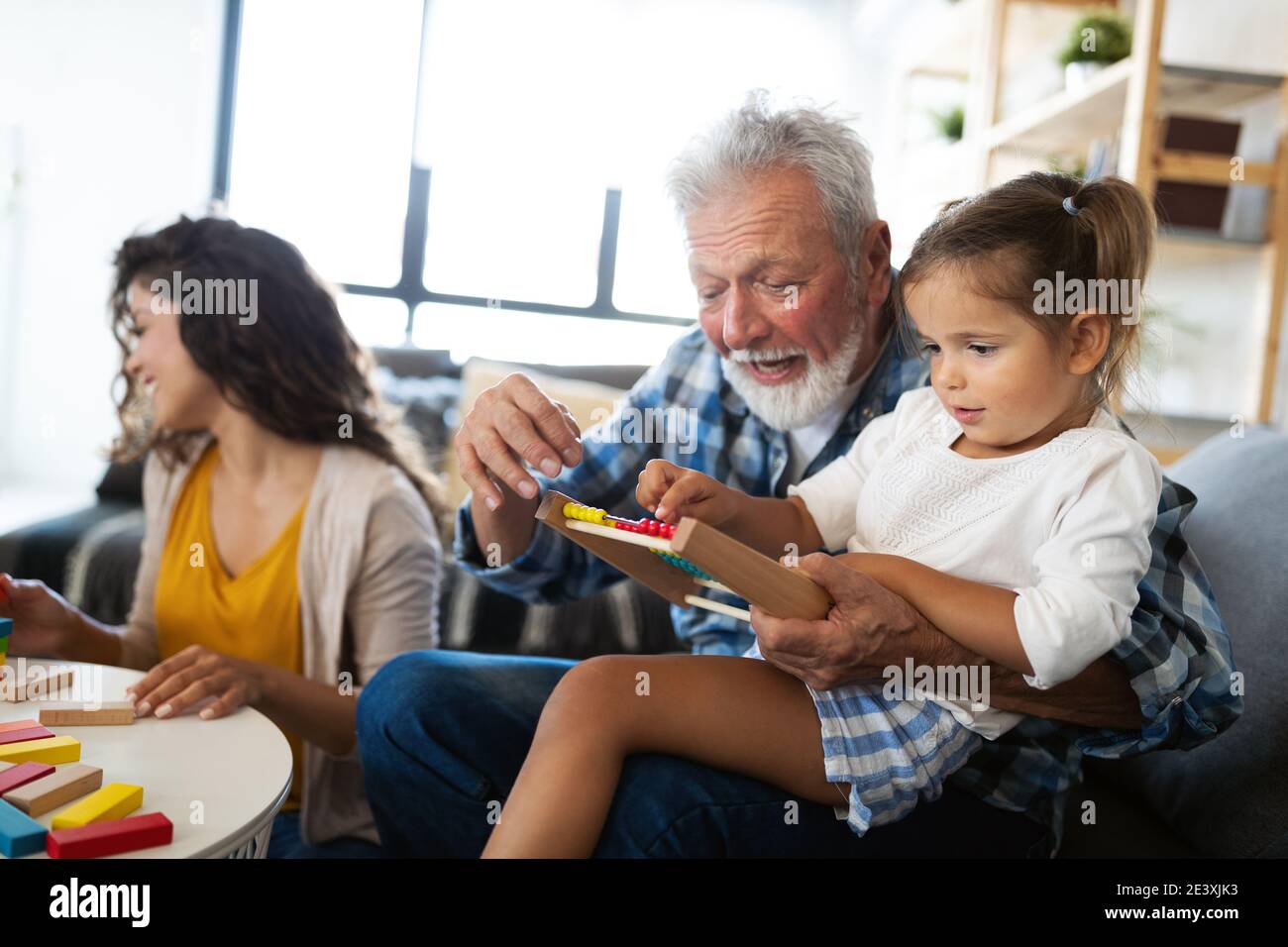 Happy family playing together and having fun at home Stock Photo - Alamy