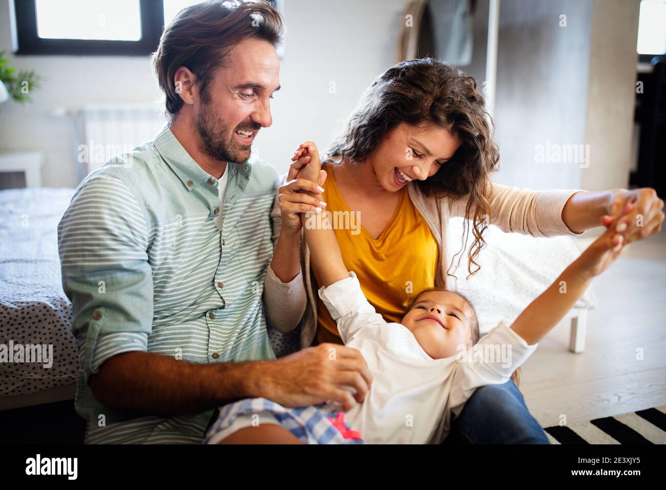Happy family having fun time at home Stock Photo - Alamy