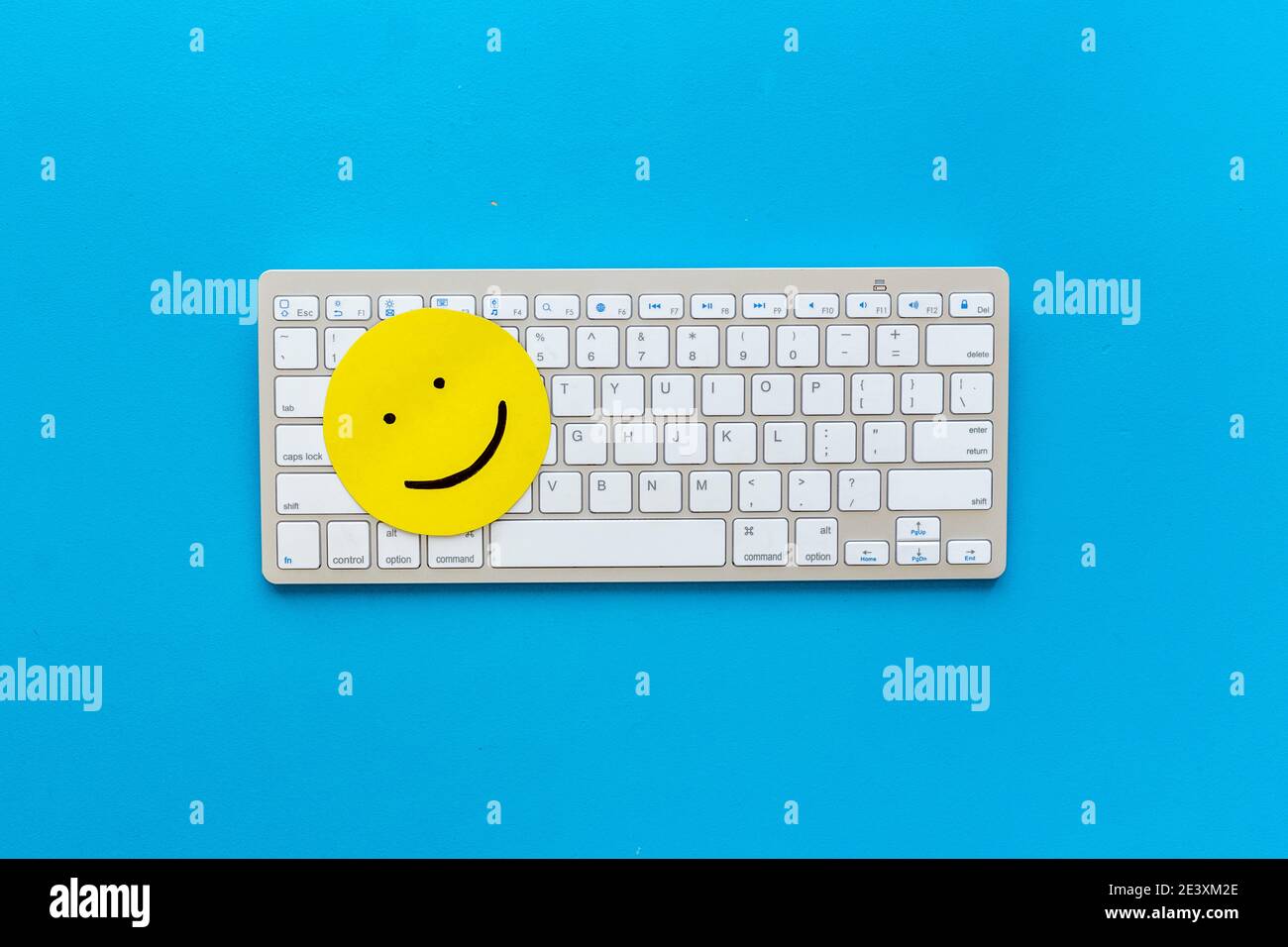 Smiling face emotion concept. Smile face on the keyboard, top view ...