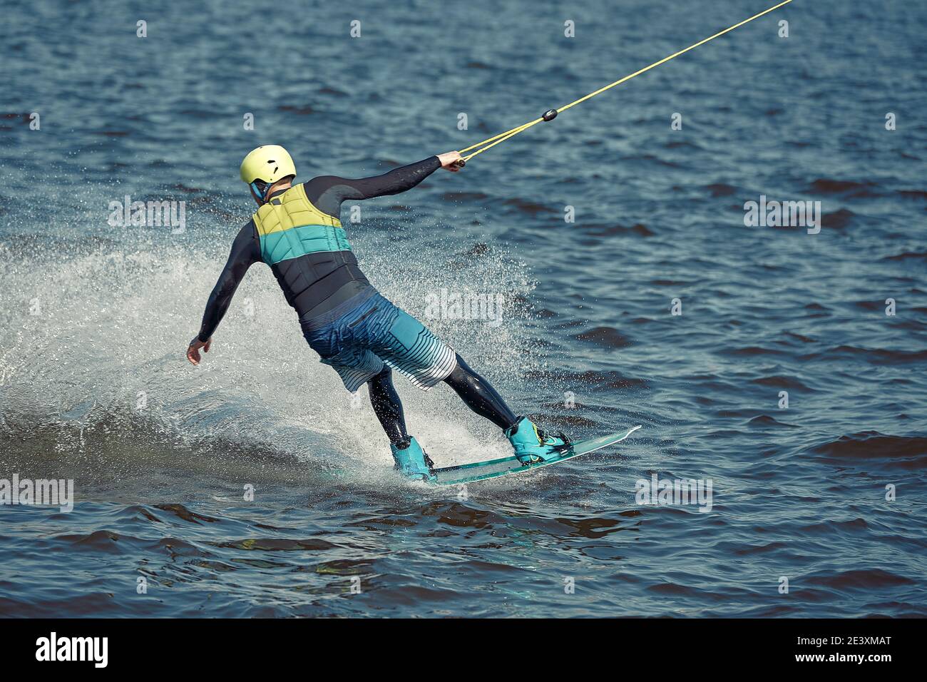 the guy is riding a wakeboard on the river. Active and Extreme Sports ...