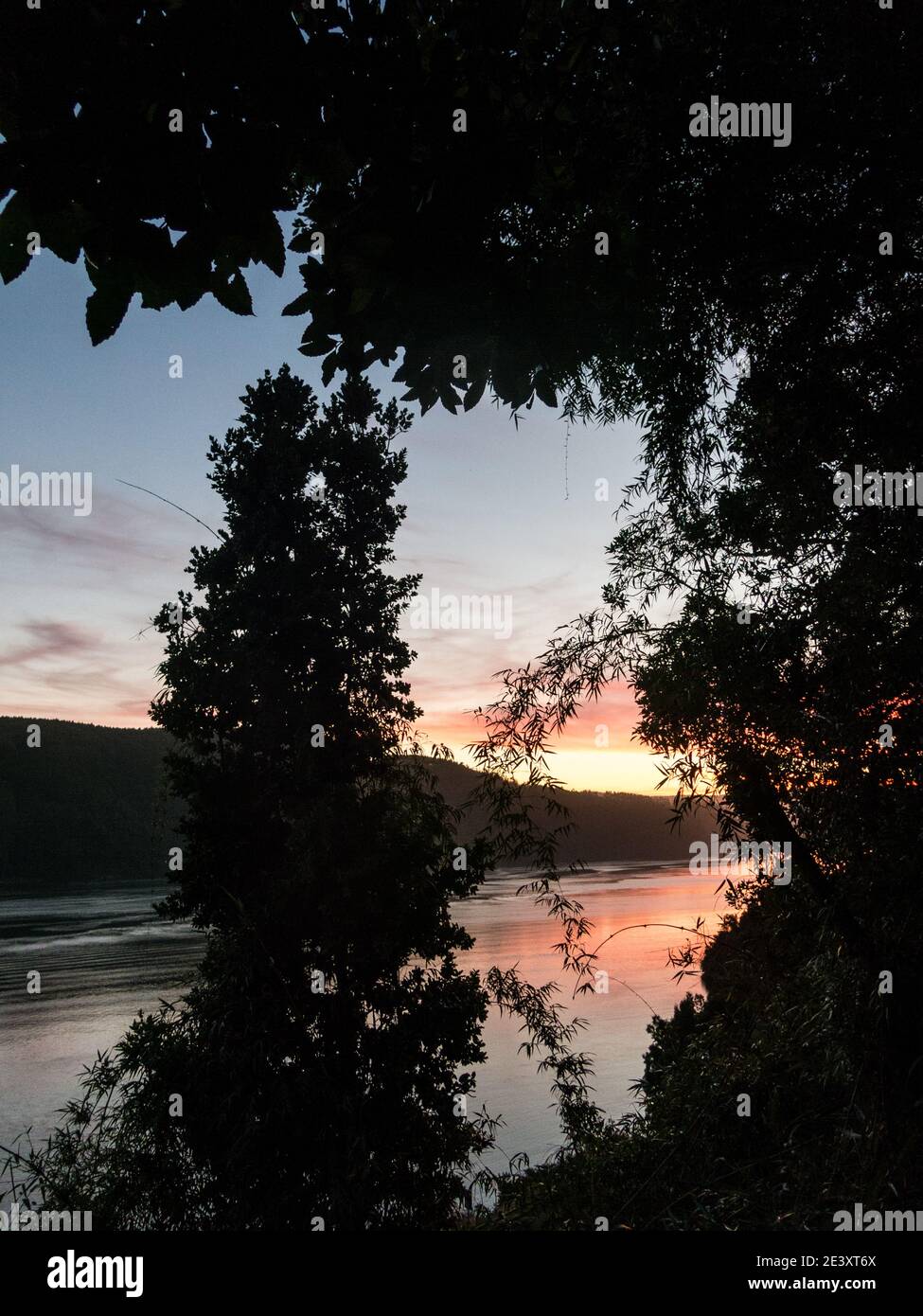 Sunset at the mouth of the Valdivia River, near the city of the same ...