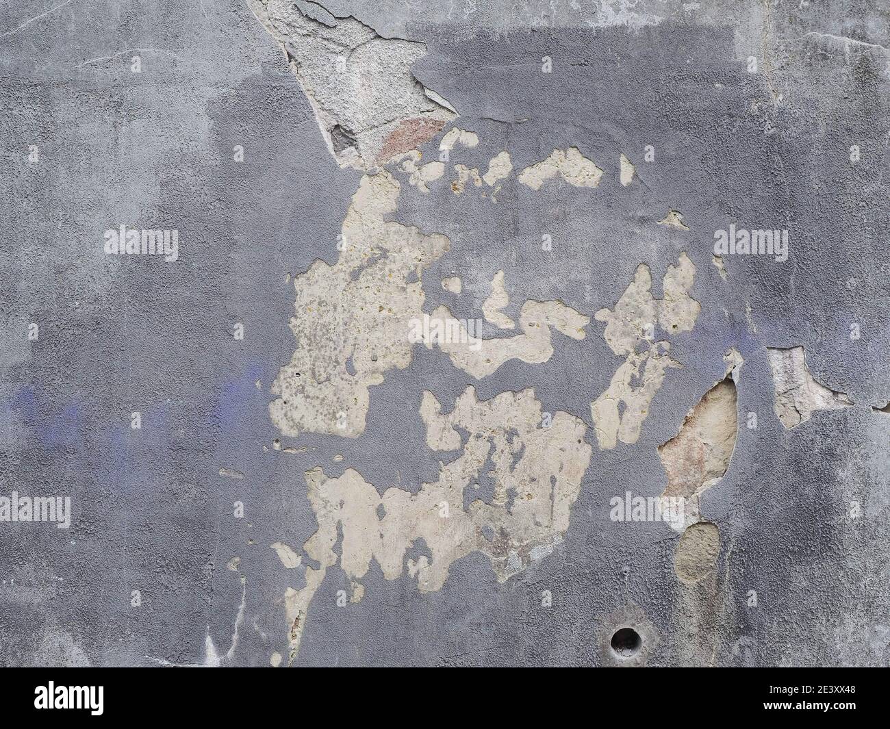 A wall with fallen off plaster in patchy gray color. Texture Stock ...