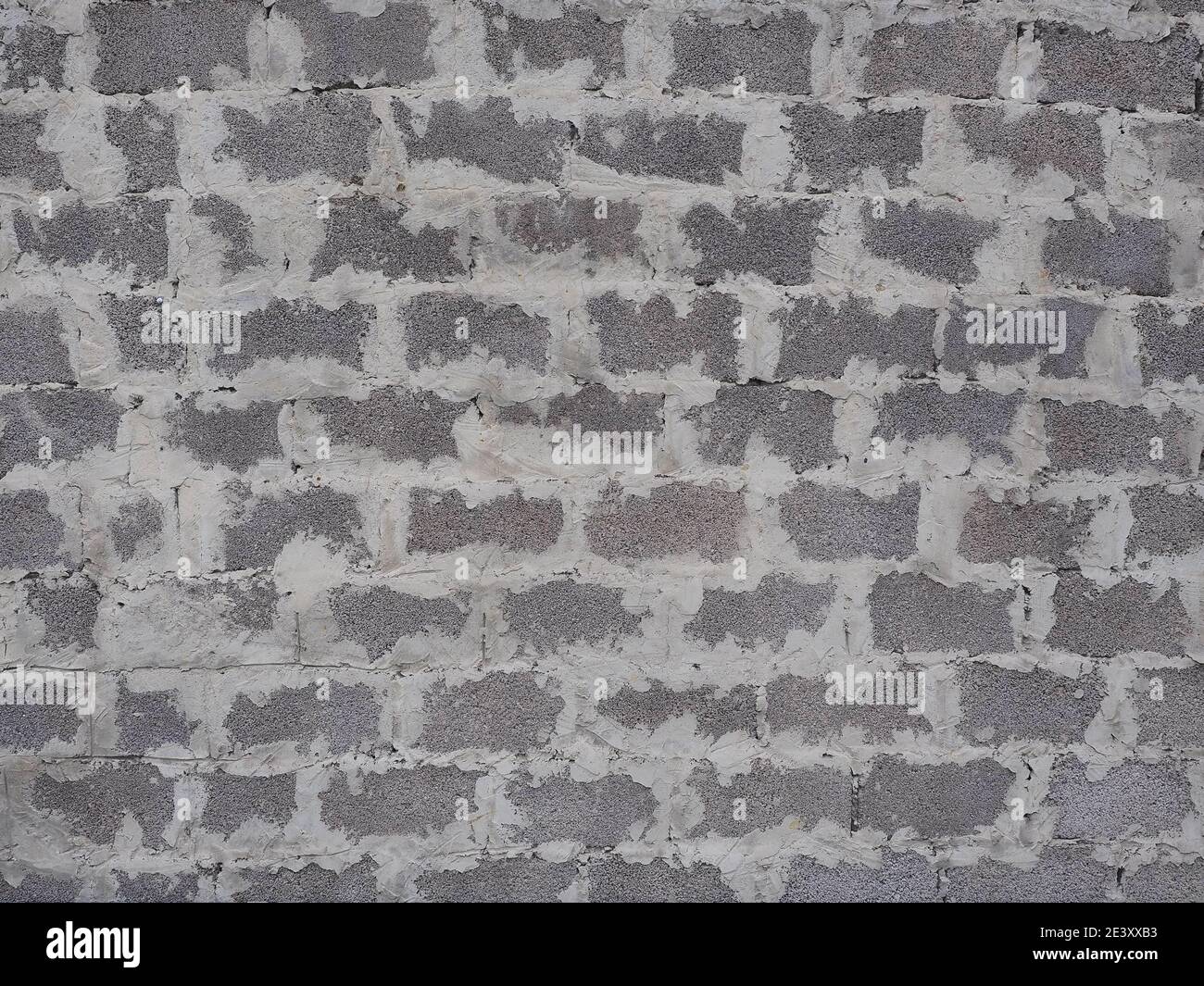 Wall with masonry of gray foam block with seams smeared with cement ...