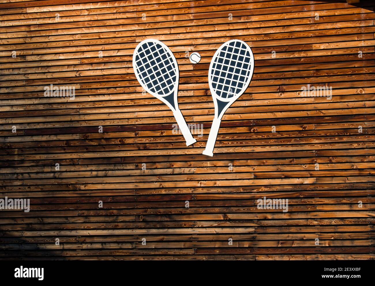 Tennis rackets and tennis ball sign on wooden background Stock Photo ...