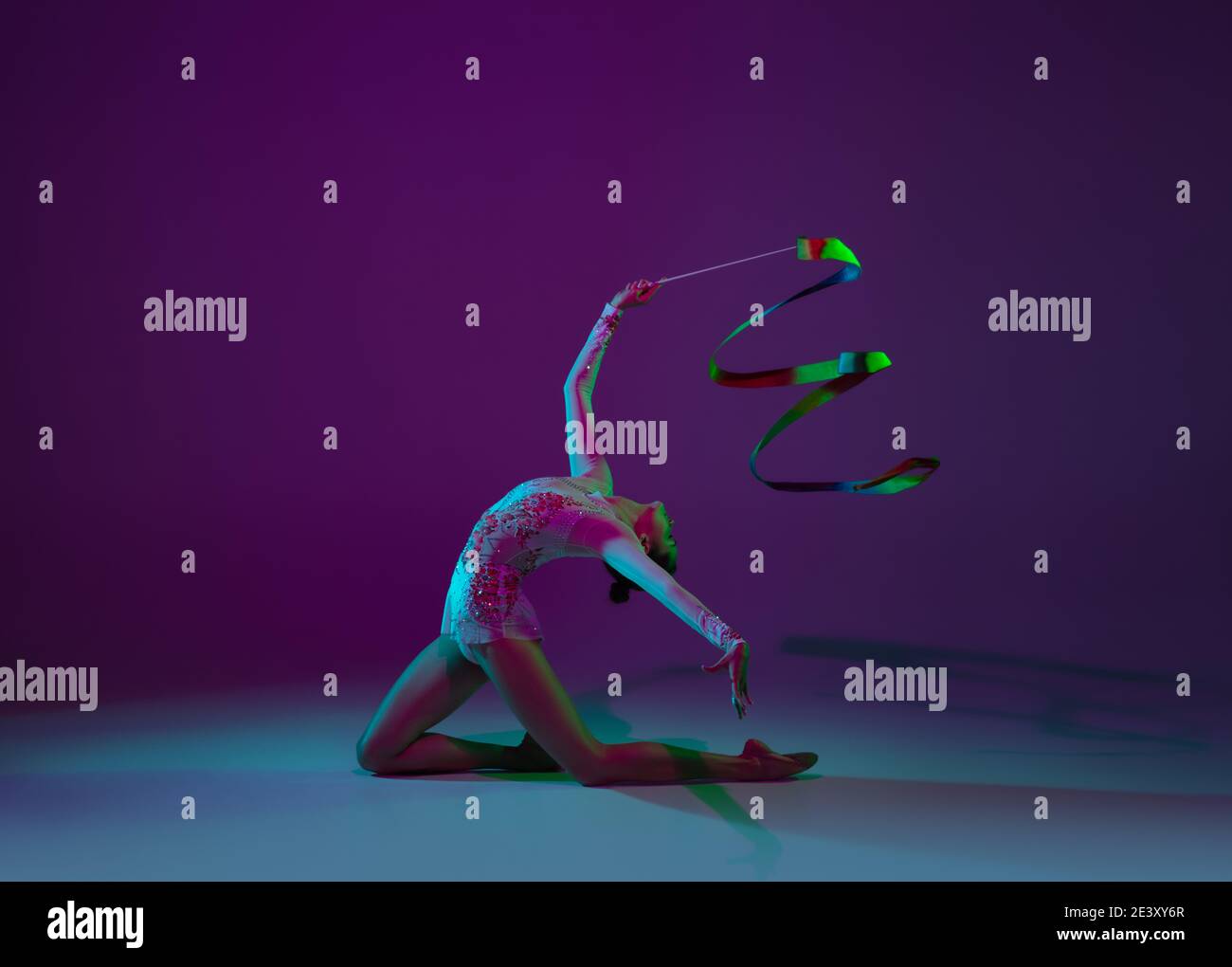 Wave. Young female athlete, rhythmic gymnastics artist dancing ...