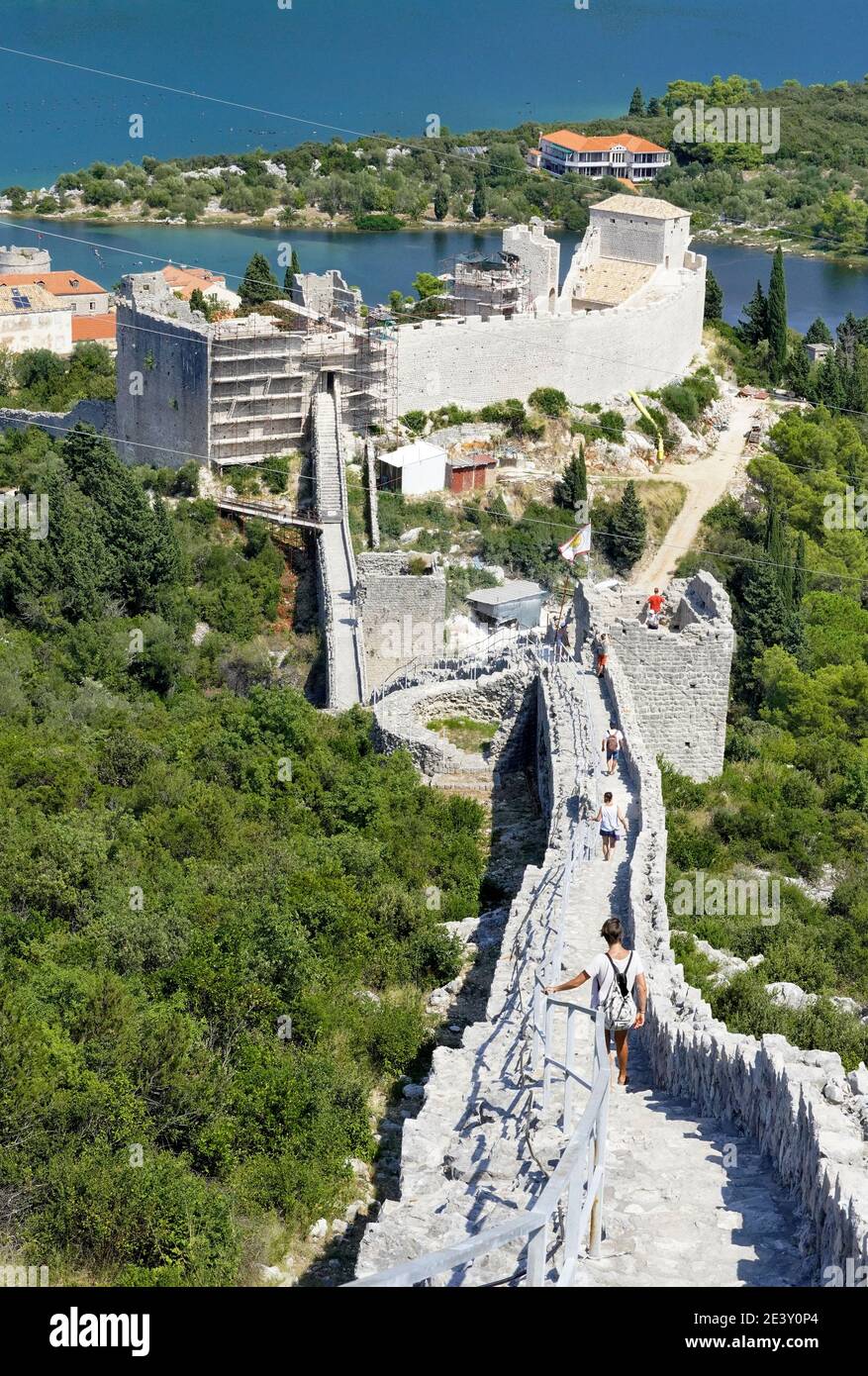 Croatia: Ston. Tourists on the fortifications of the Great Wall of Ston ...