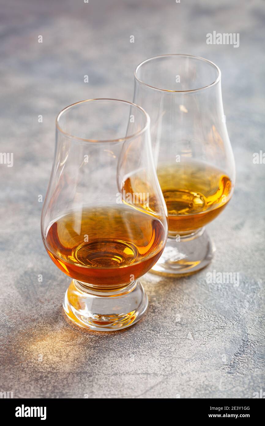 glass of whisky spirit brandy on gray concrete background Stock Photo ...