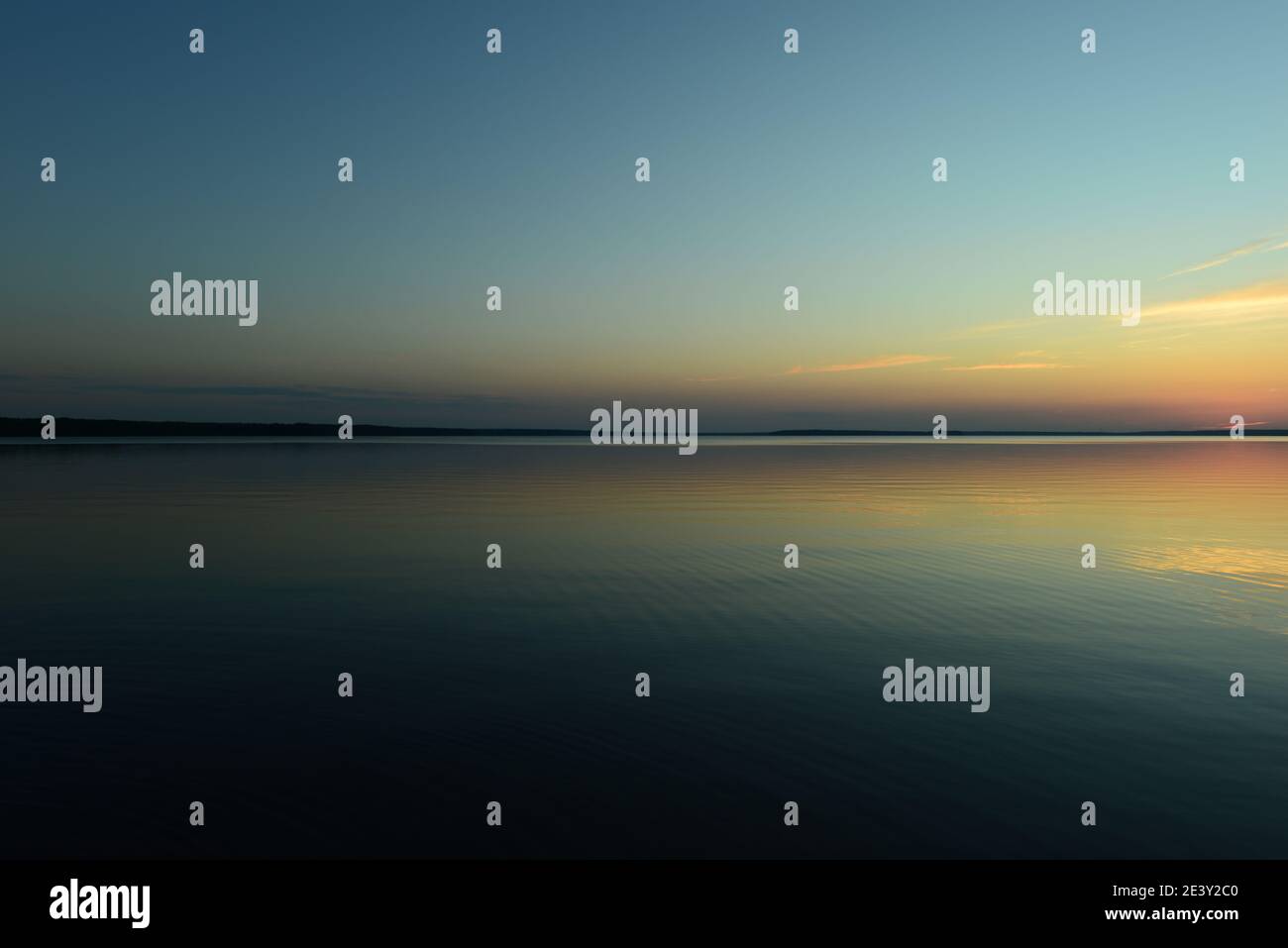 Calming twilight view on the lake with blue water Stock Photo - Alamy