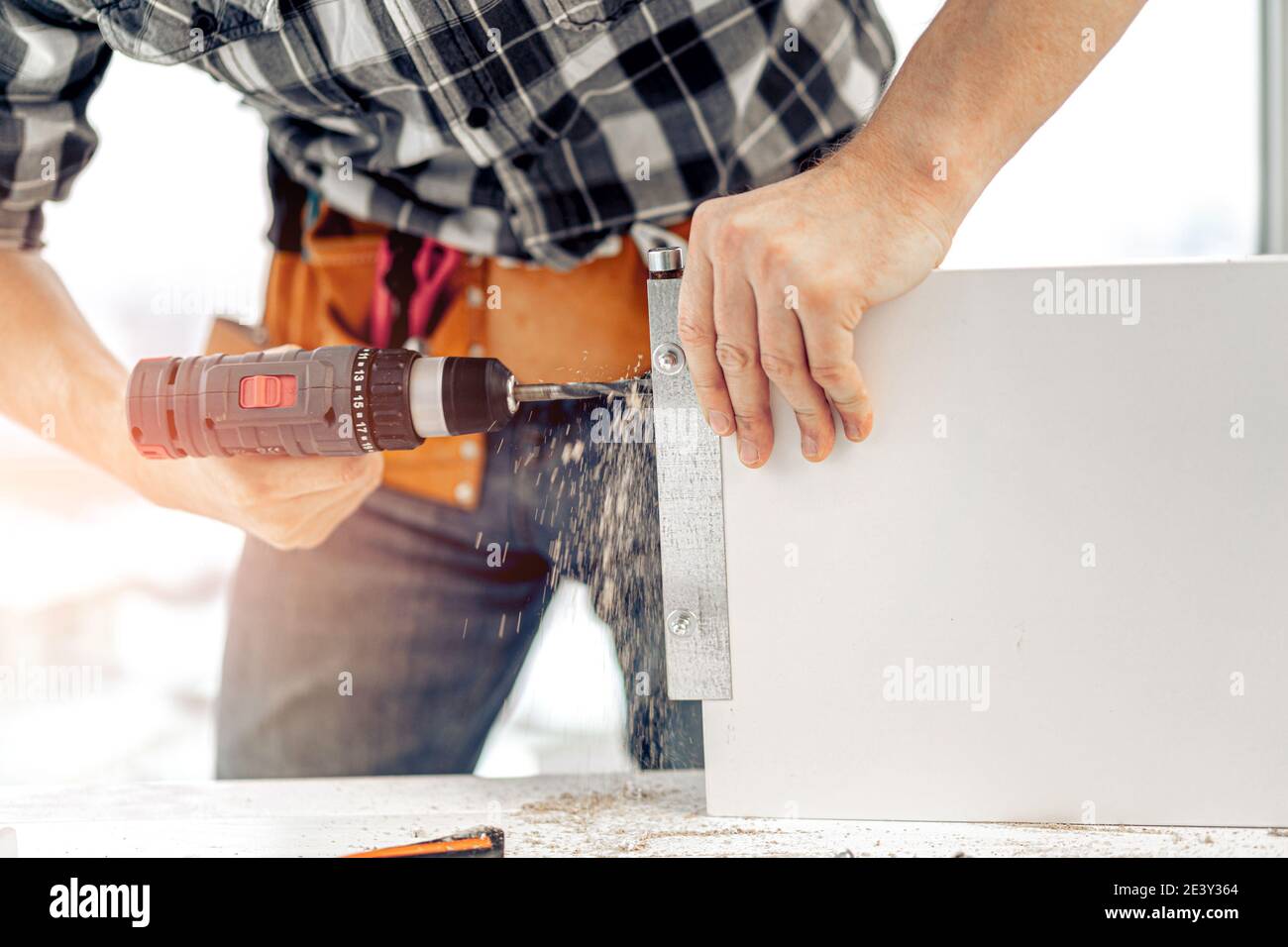Man working during process of furniture manufacturing Stock Photo - Alamy