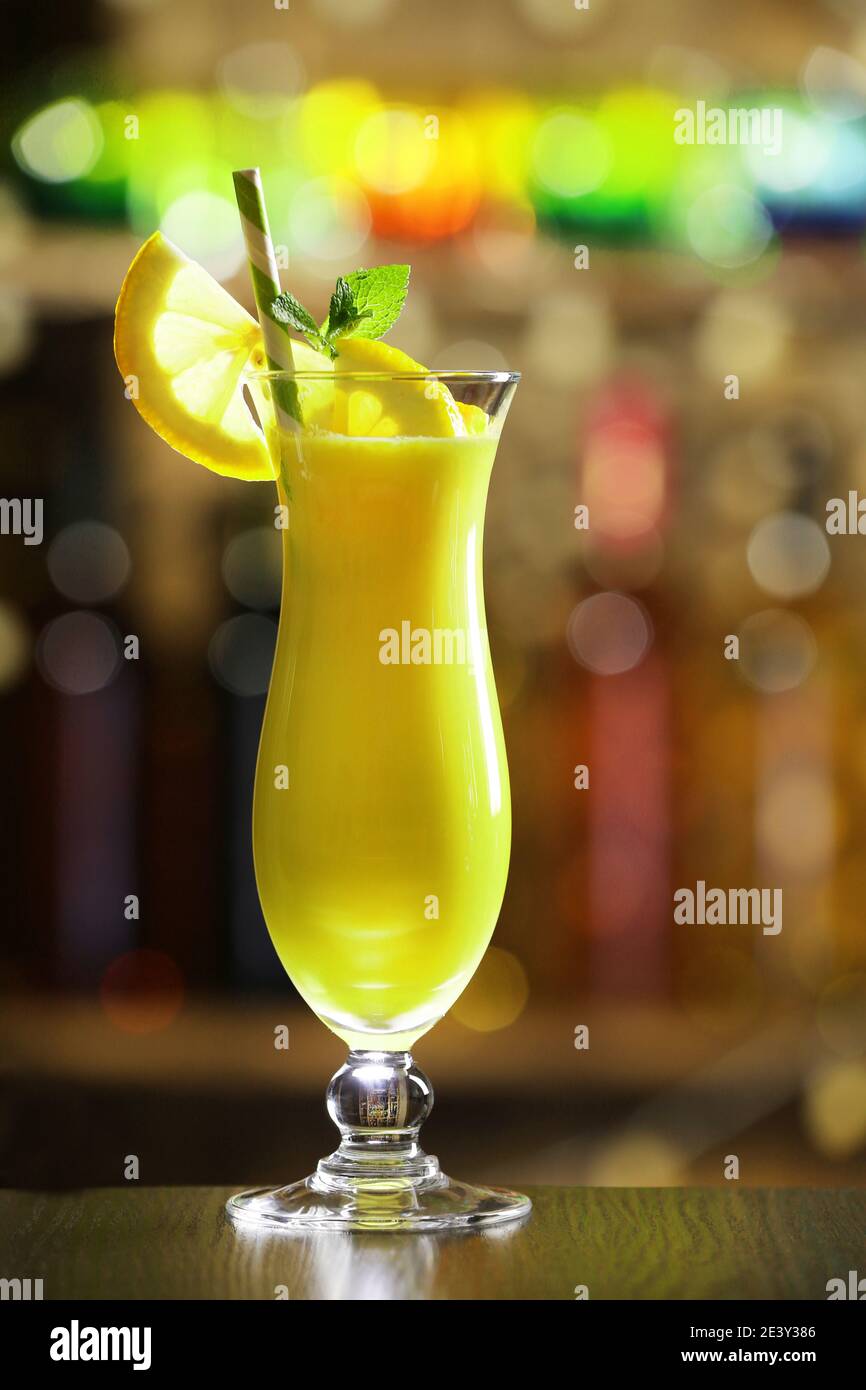 Yellow cocktail in a tall glass Stock Photo - Alamy