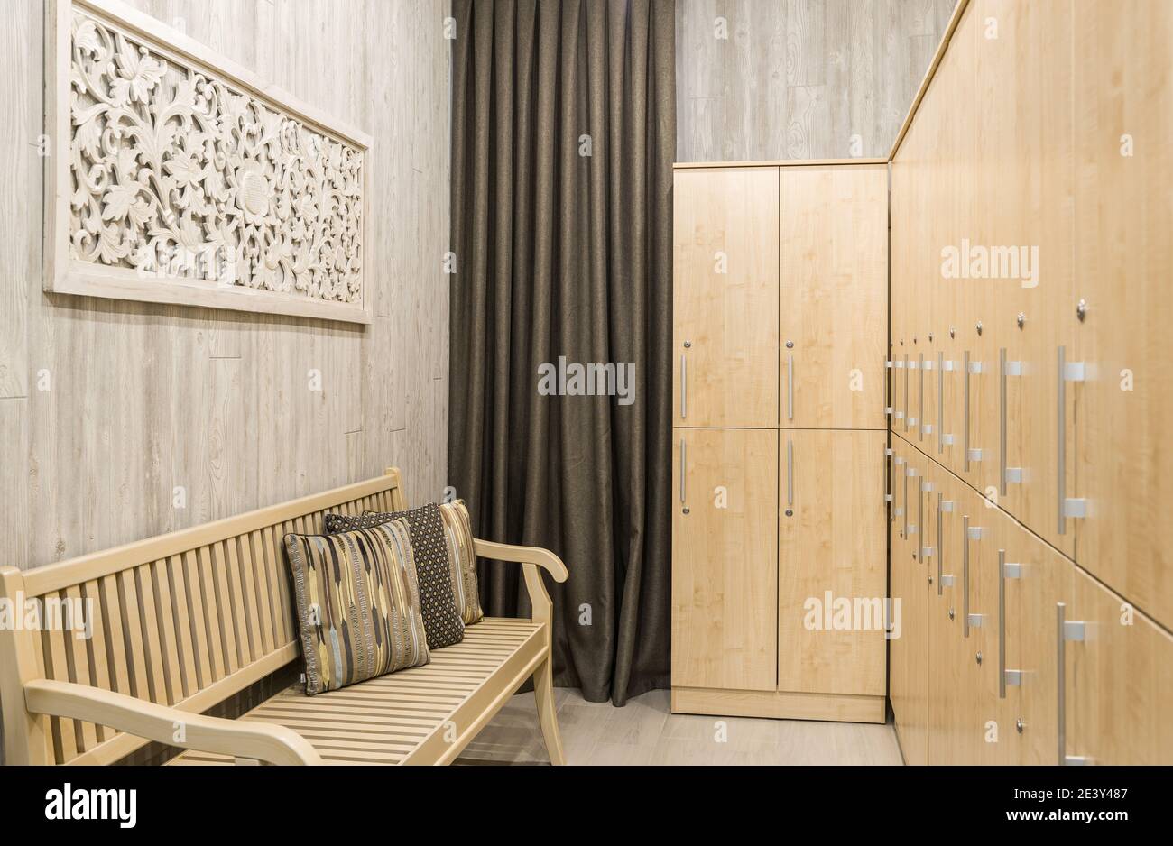 Dressing room interior with wardrobe and bench Stock Photo - Alamy