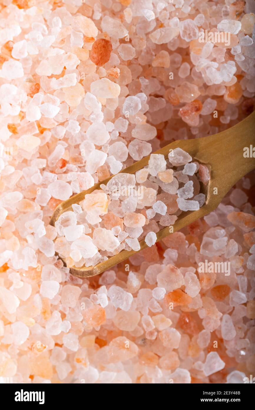 Pink Himalayan salt. Himalayan salt pile. Pink crystal salt in wooden ...