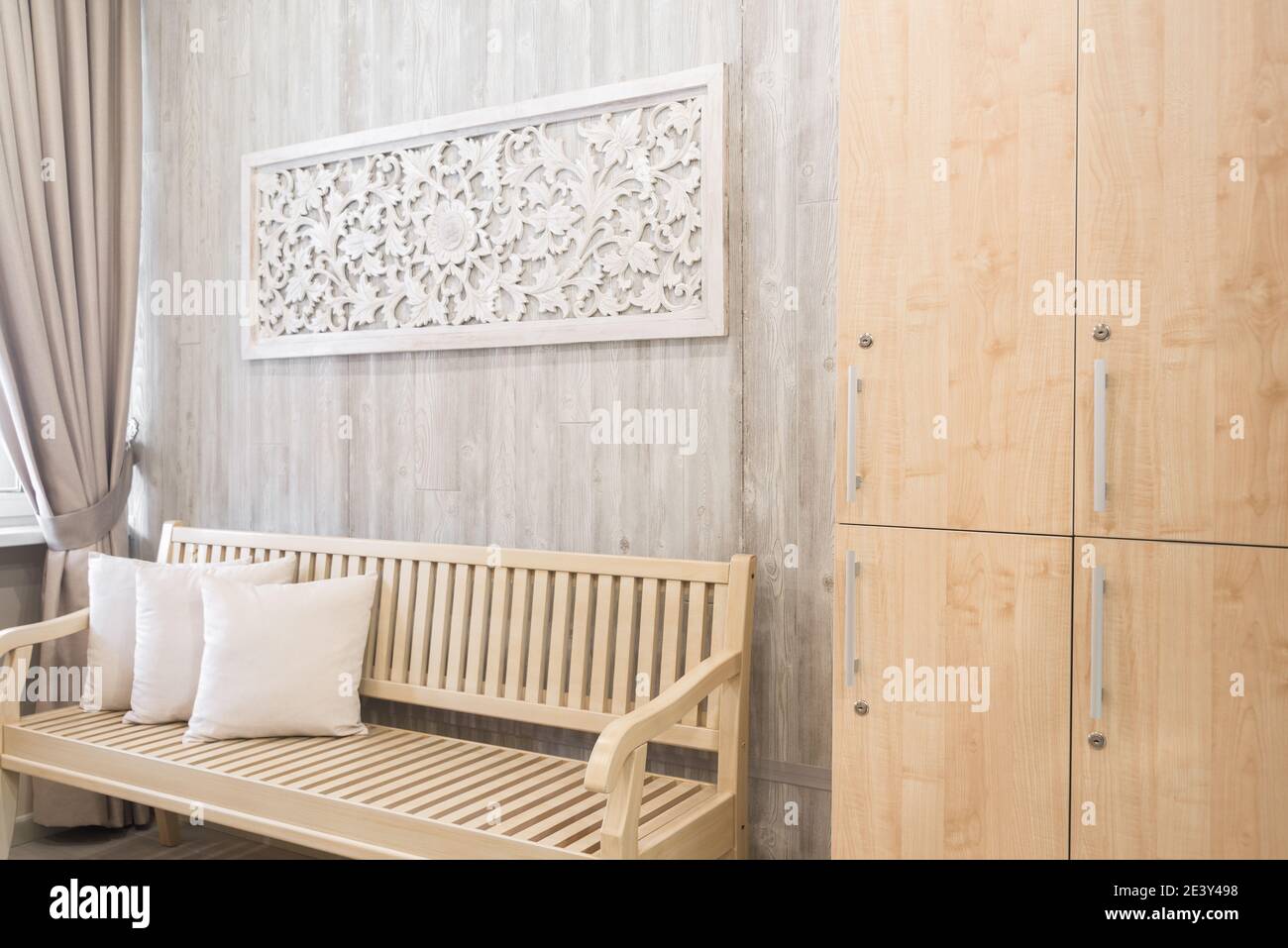 Dressing room interior with wardrobe and bench Stock Photo - Alamy