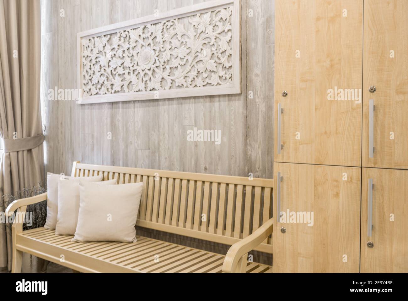 Dressing room interior with wardrobe and bench Stock Photo - Alamy