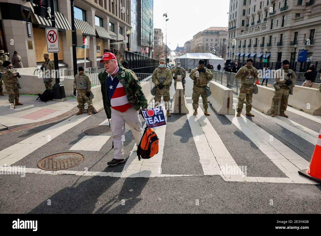 Trump supporter, James Schenk protests, while carrying a "Stop the ...