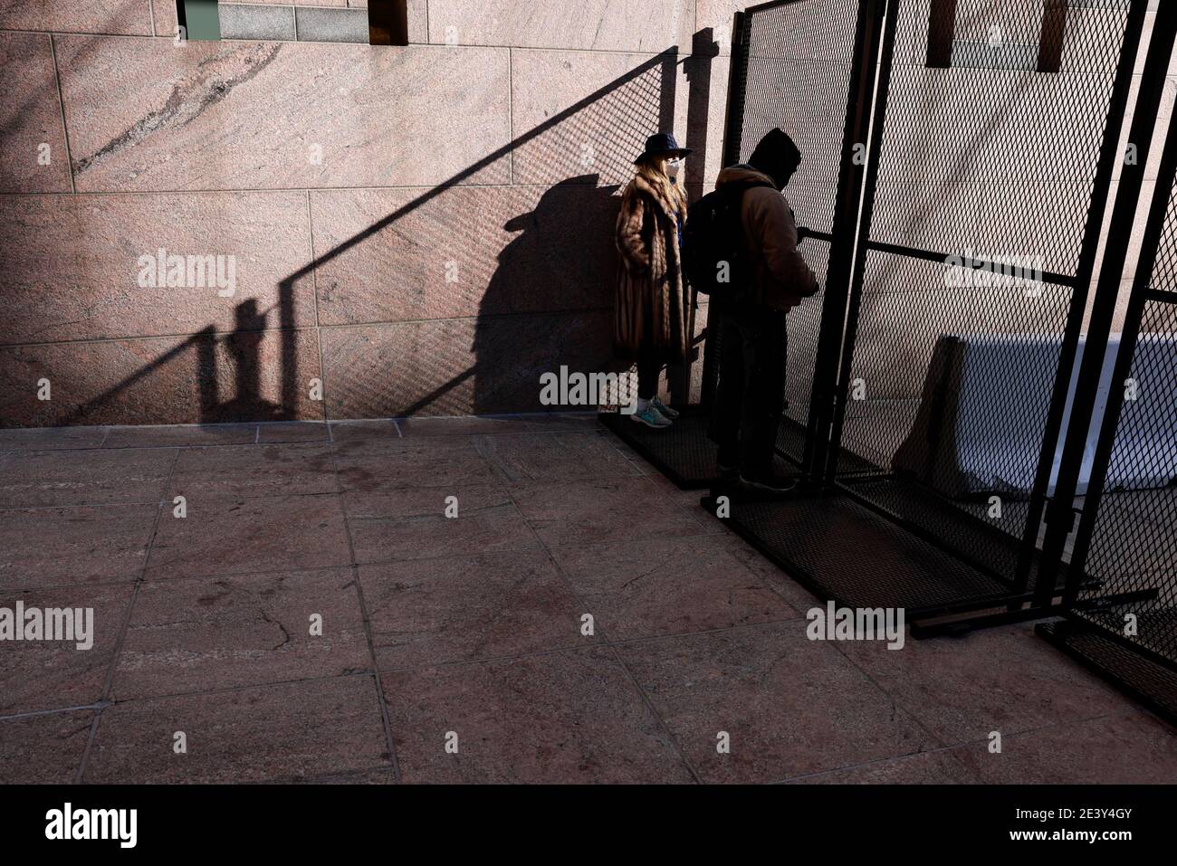 Inauguration attendees wait to see the inauguration parade of President ...