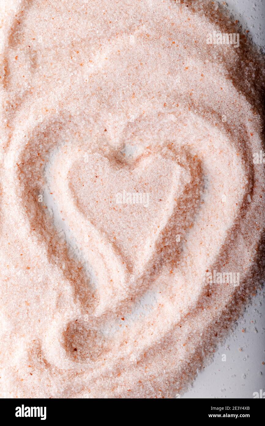 Pink Himalayan salt powder with a heart-shaped mark on it. Food ...