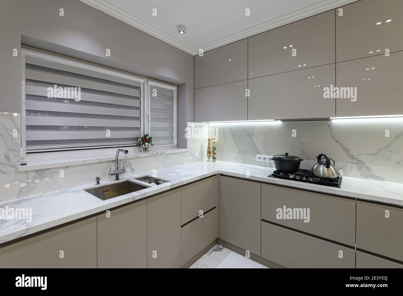 Luxury white modern marble kitchen in studio space Stock Photo - Alamy