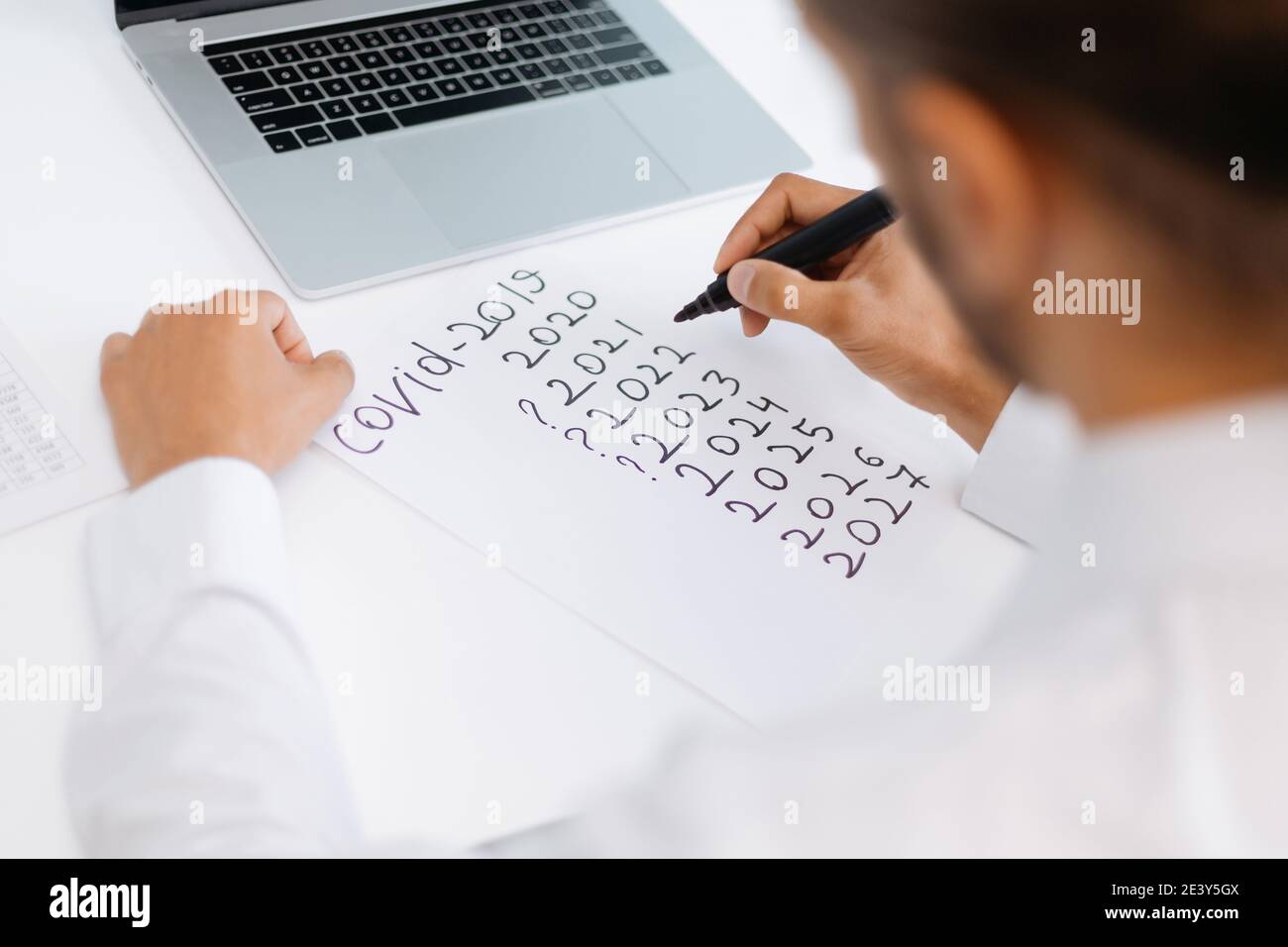 business man predicting the consequences of the pandemic Stock Photo ...