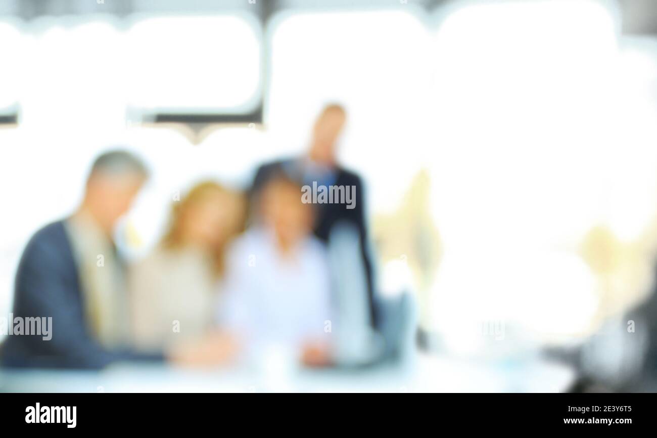 background image of a group of young people at a meeting in a ...