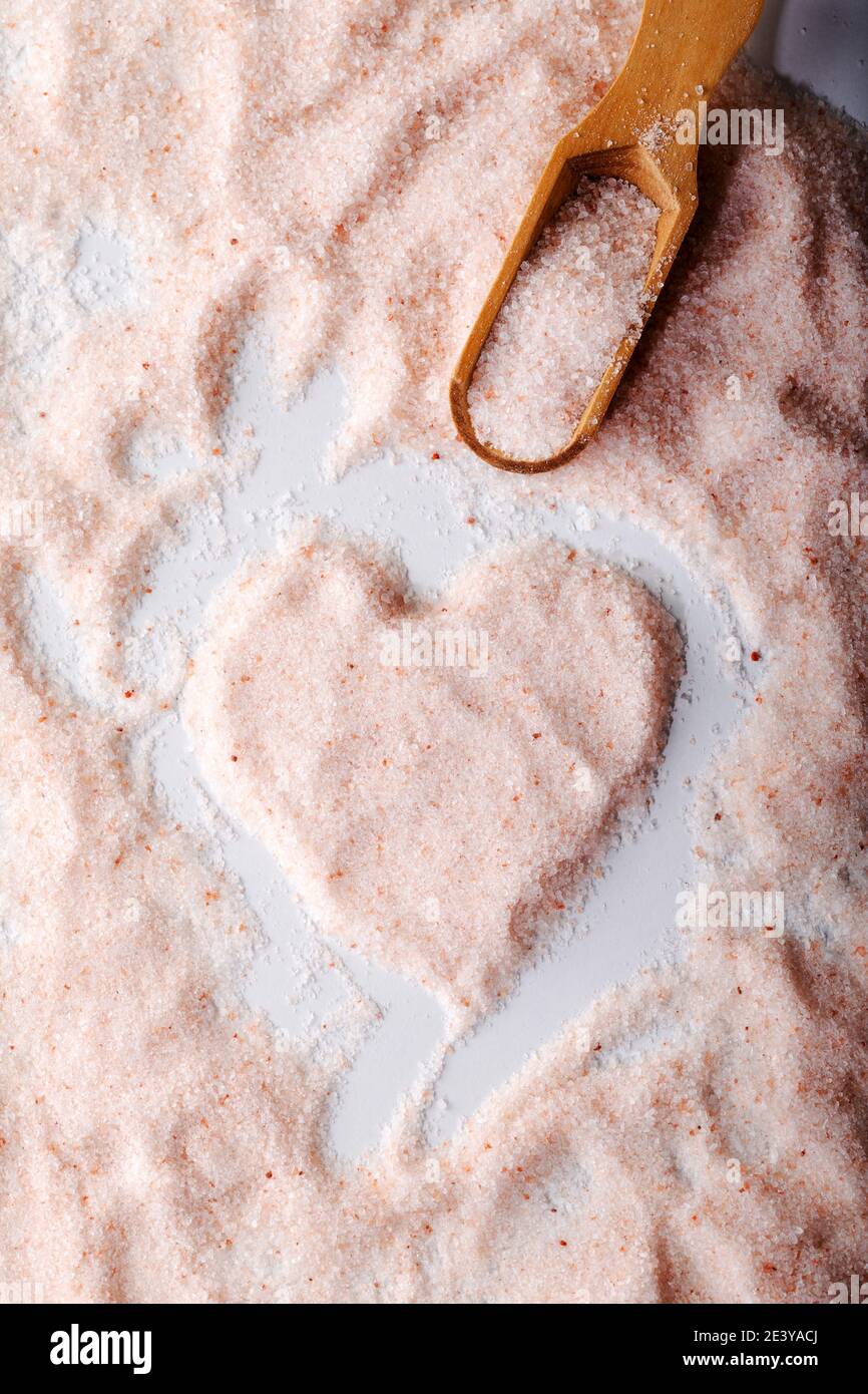 Pink Himalayan salt powder with a heart-shaped mark on it. Food ...