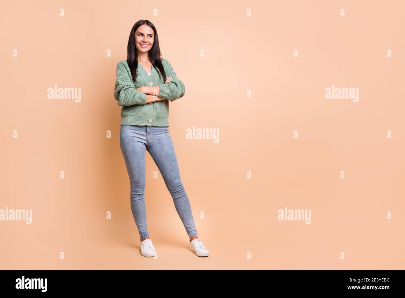 Full size photo of charming pretty woman look stand empty space crossed ...