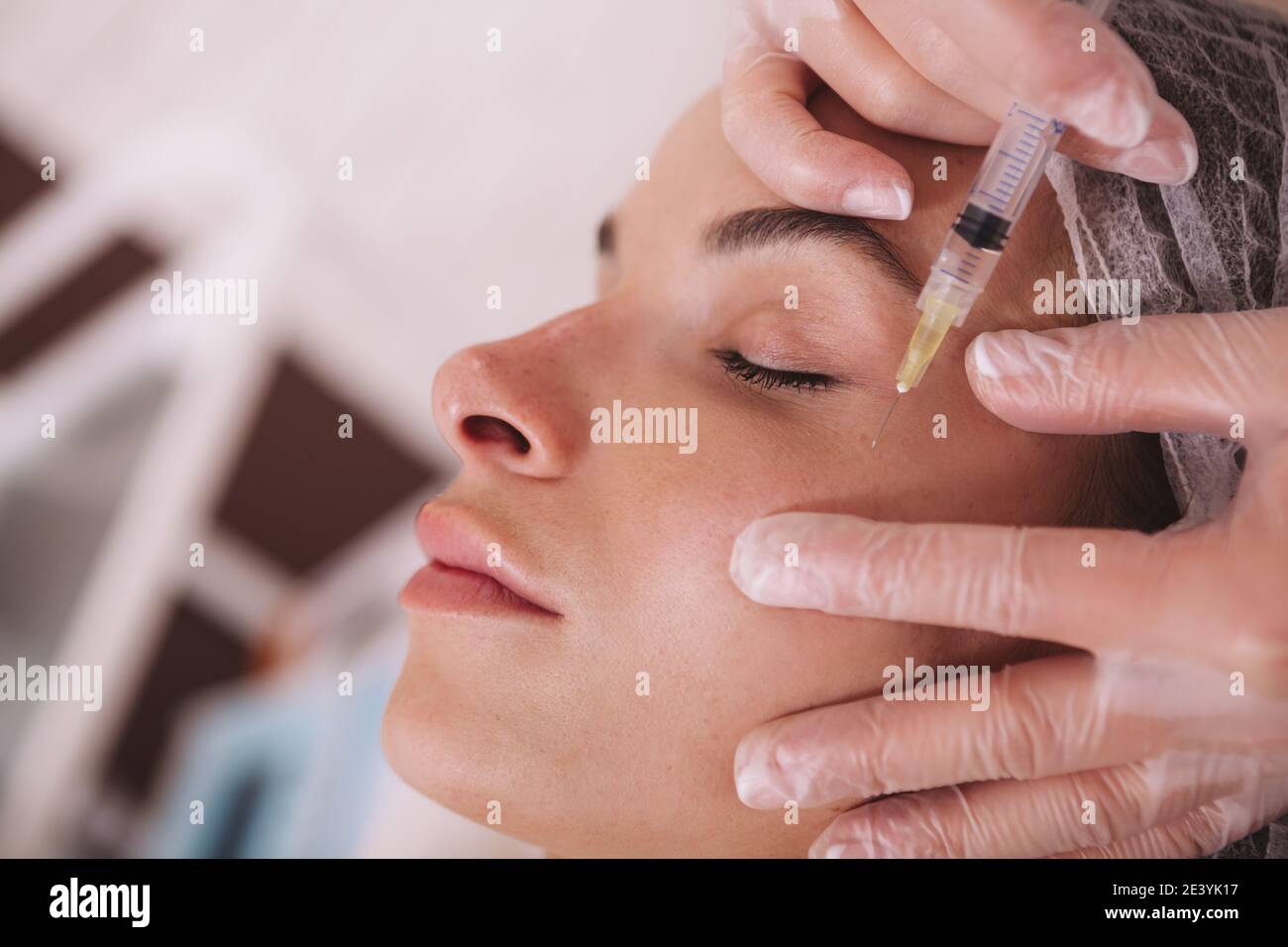 Cropped close up of a beautiful woman receiving anti-wrinkle treatment ...