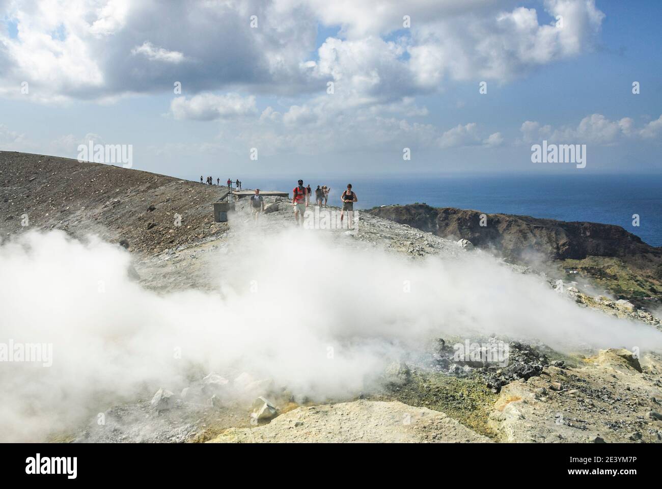 Hikers on the ridge of Volcano crater Stock Photo - Alamy