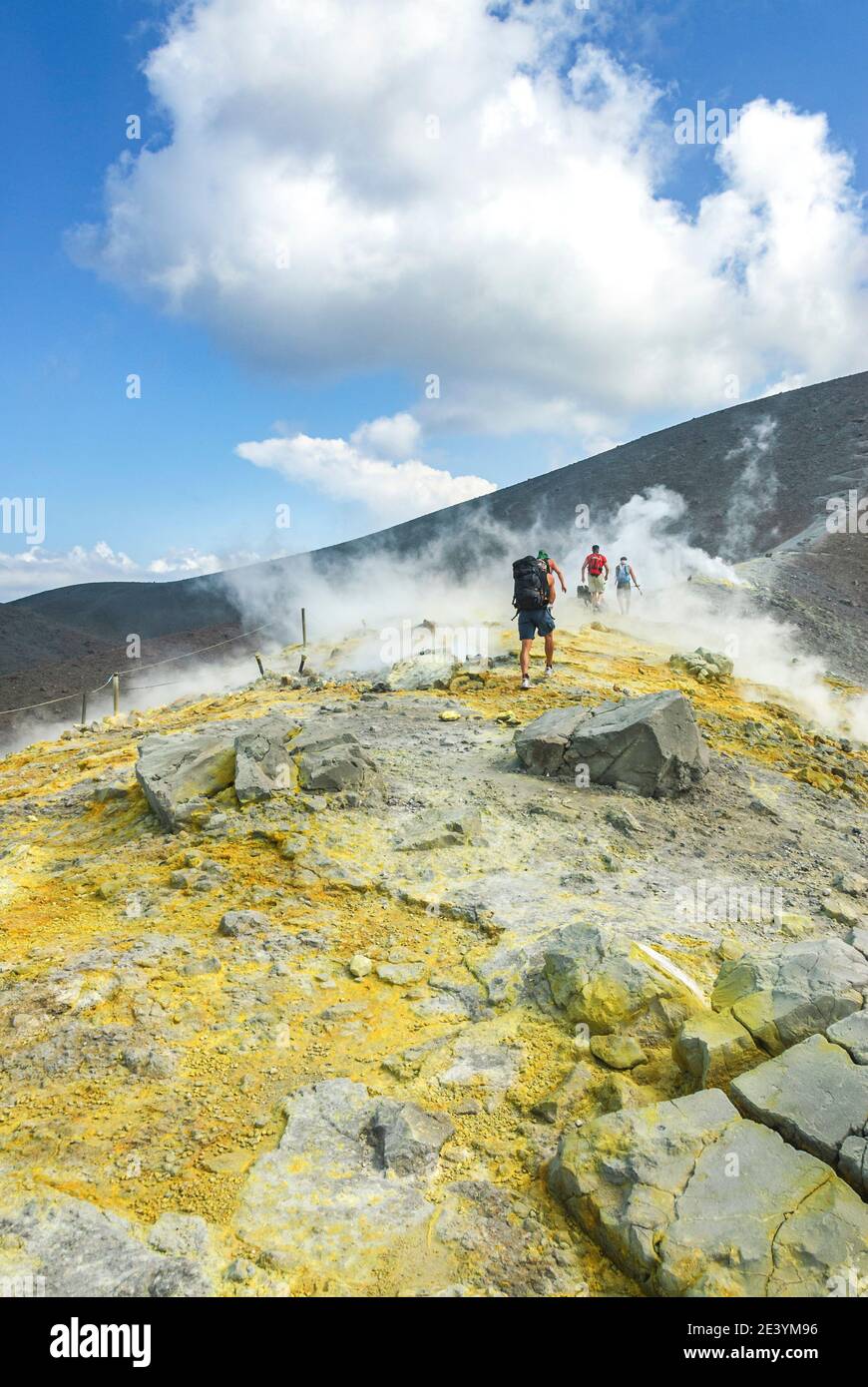 Hikers on the ridge of Volcano crater Stock Photo - Alamy