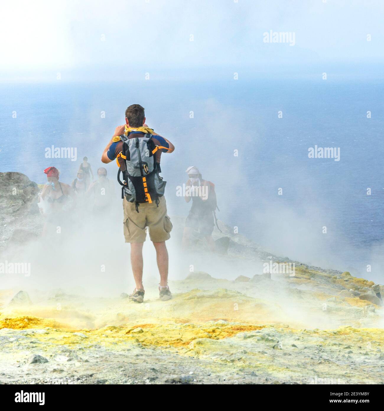 Hikers on the ridge of Volcano crater Stock Photo - Alamy