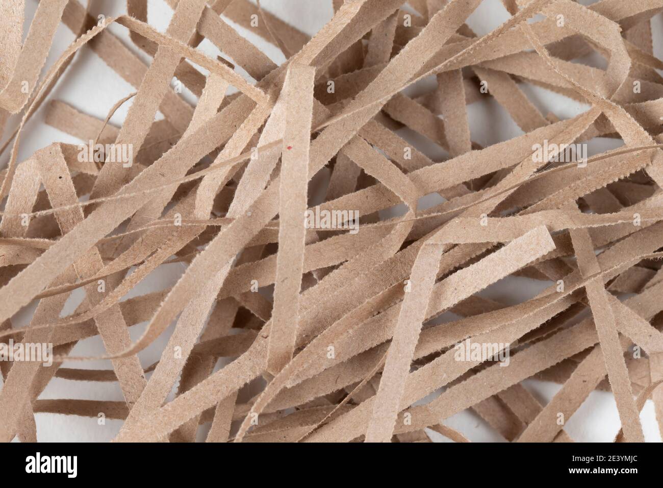 Lots of thin strips of beige paper. Decorative pieces of paper for ...