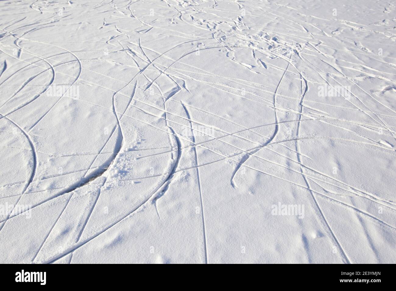 Skate tracks on ice with snowy snow. Winter background Stock Photo - Alamy