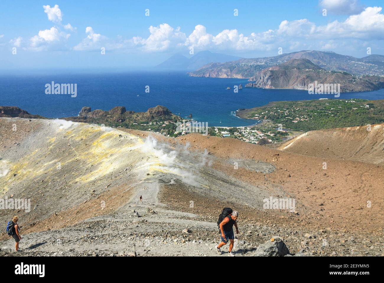 Hikers on the ridge of Volcano crater Stock Photo - Alamy