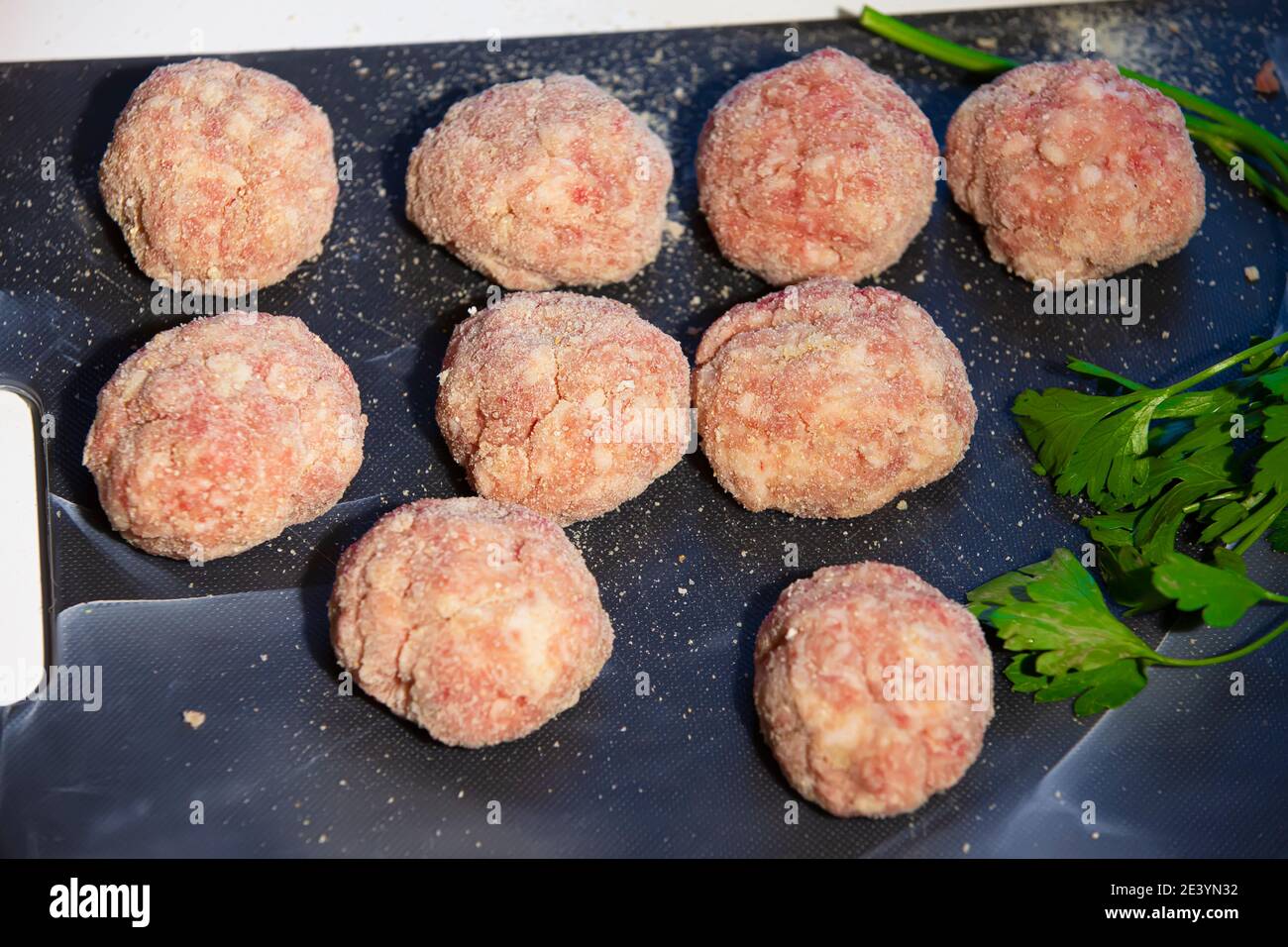 Cooking meat cutlets. Semi-finished meatballs on a cutting board Stock ...