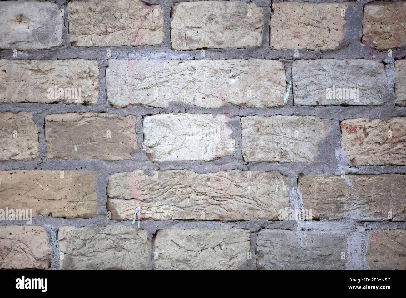 Brick wall. Uneven brick texture close up Stock Photo - Alamy