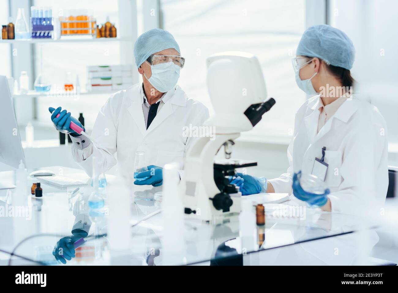 scientists discussing their research in the laboratory Stock Photo - Alamy