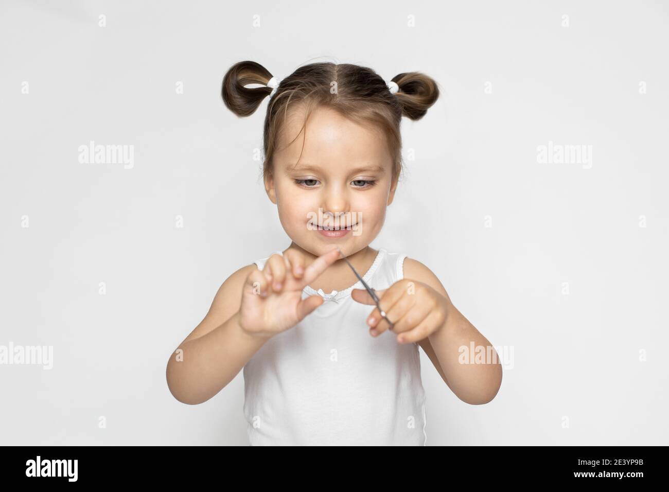 Child's hygiene and care concept. Horizontal studio shot of cheerful ...
