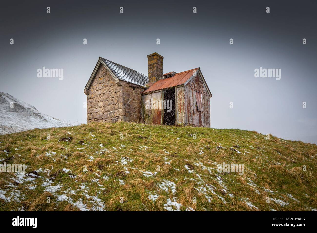 A tiny Scottish cottage in a snow storm Stock Photo - Alamy