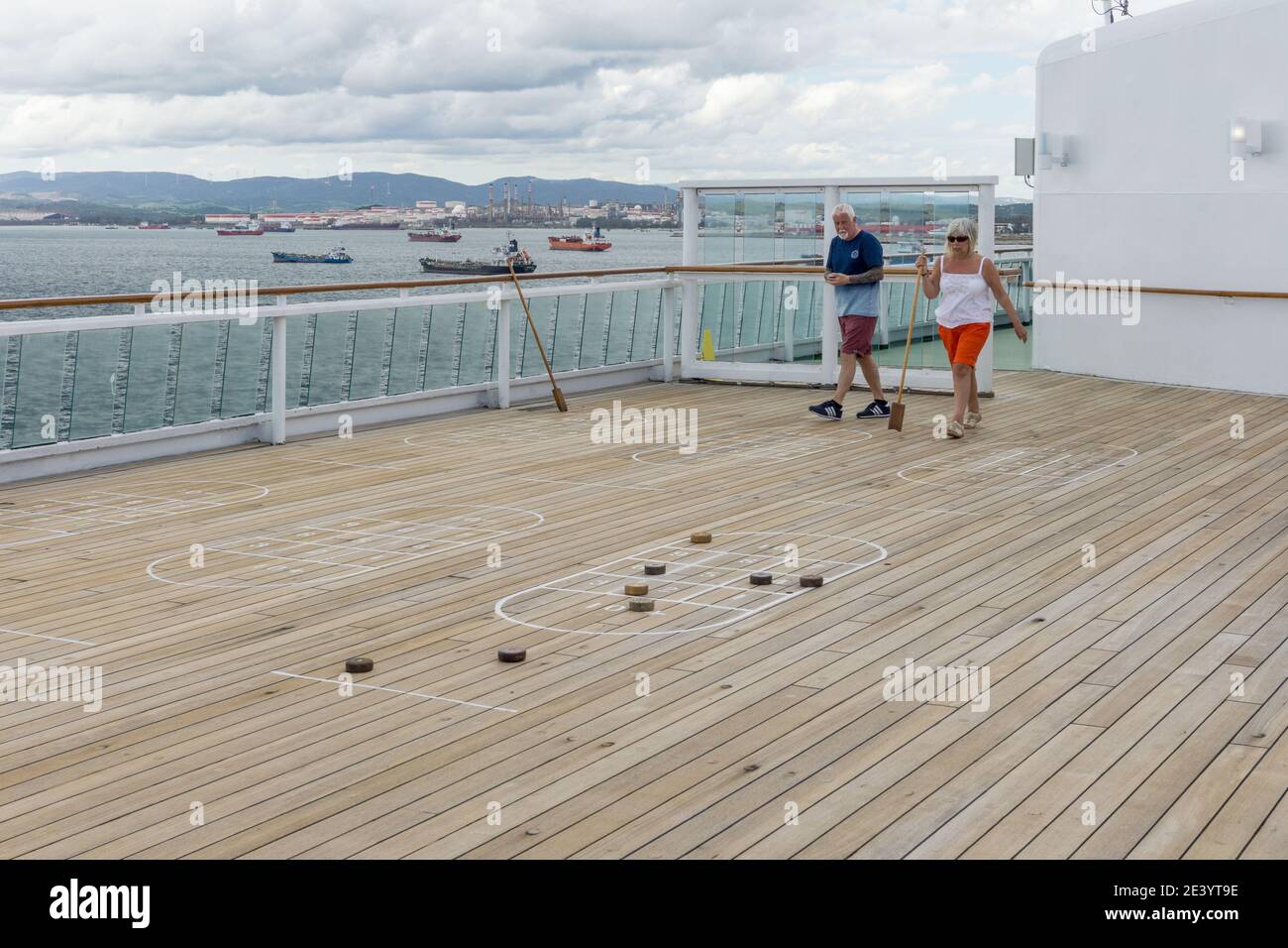 Couple playing deck quoits on the P&O cruise ship Aurora whilst moored ...