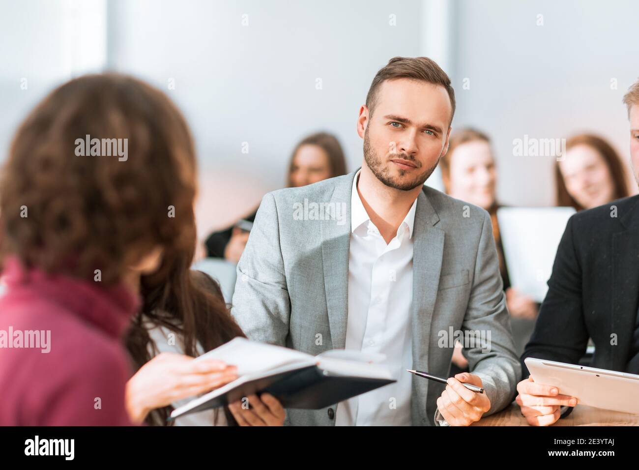 close up. brooding entrepreneur sitting at office Desk Stock Photo - Alamy