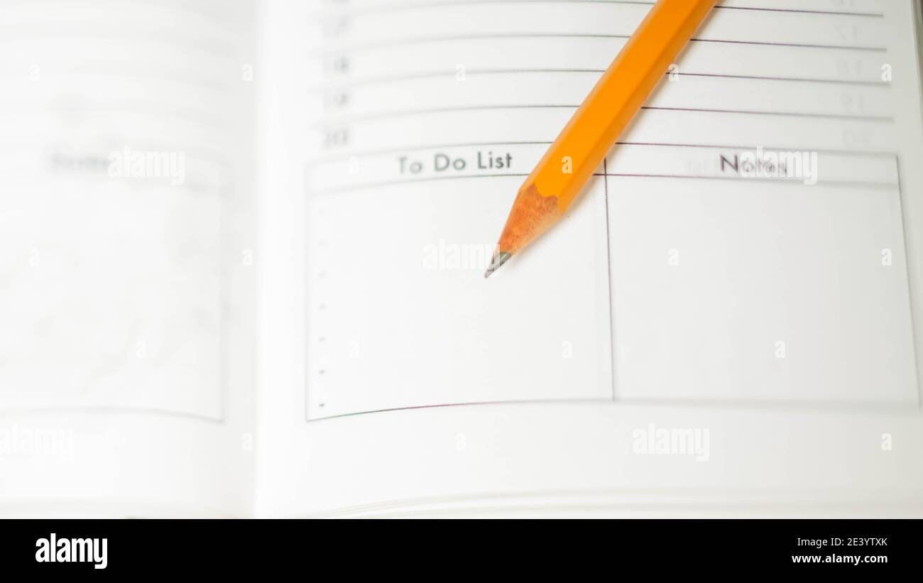 Pencil on opened diary notebook. Empty To do list and Notes. Close-up ...