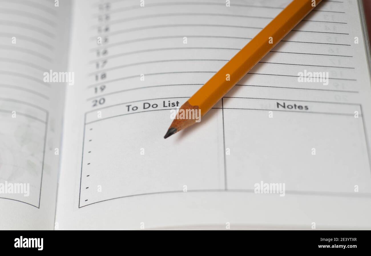 Pencil on opened diary notebook. Empty To do list and Notes. Close-up ...