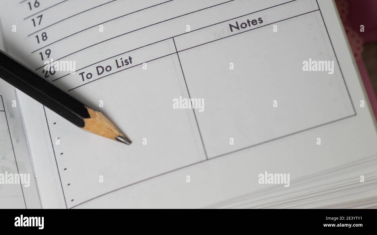 Pencil on opened diary notebook. Empty To do list and Notes. Close-up ...